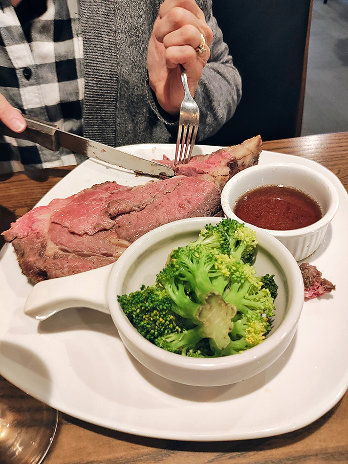 Prime rib cooked to that perfect rosy hue where carnivores and food photographers find rare common ground.