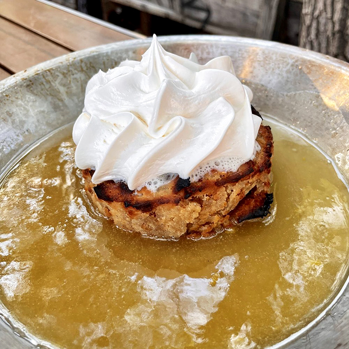 Bread pudding swimming in bourbon sauce with a cloud of whipped cream &ndash; dessert or a religious experience? You decide.