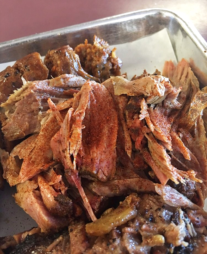 Pulled pork that doesn't need Instagram filters to look this good. Each tender strand carries the perfect balance of smoke, spice, and natural pork flavor.