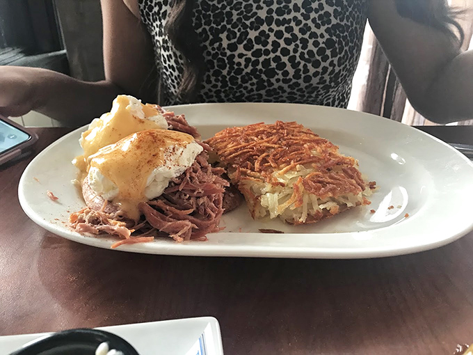 This isn't just pulled pork&mdash;it's pork that's been coaxed, sweet-talked, and gently convinced to reach its full potential. Those hash browns deserve their own fan club.