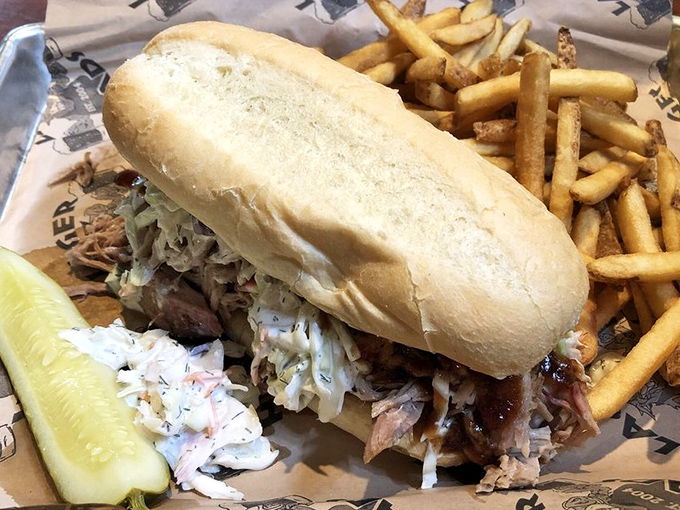 A pulled pork sandwich that doesn't skimp on the main attraction. That pile of tender, smoky meat is what BBQ dreams are made of.