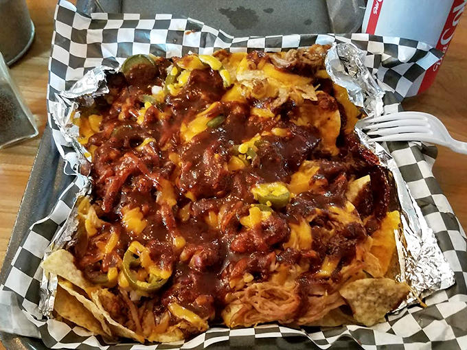 Nachos reimagined as a barbecue delivery system &ndash; where pulled pork, melted cheese, and jalape&ntilde;os create a holy trinity of flavor worth worshipping.
