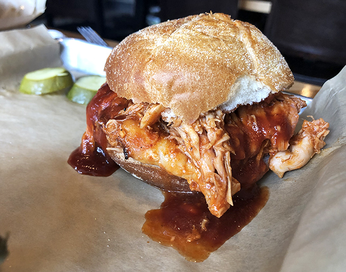 Pulled pork perfection: tender strands of smoky pork bathed in sauce, ready to transport you to barbecue nirvana with each bite.