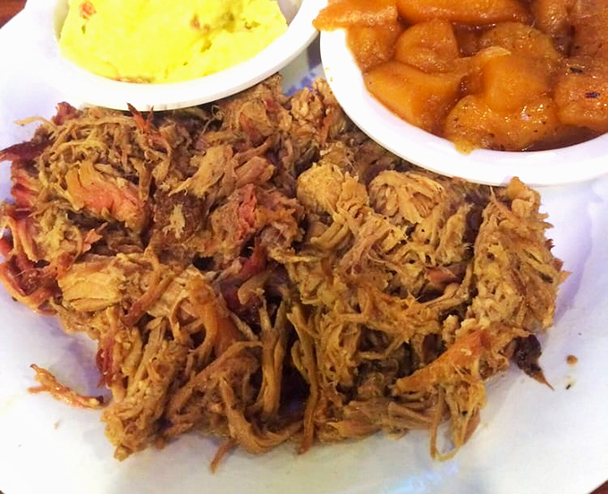 Pulled pork that's been coaxed into tender submission after hours in the smoker. Paired with cornbread and applesauce, it's a southern hug on a plate.