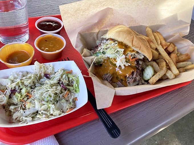 A pulled pork sandwich that doesn't need a fancy introduction, just your immediate attention, paired with coleslaw that actually earns its place on the plate.