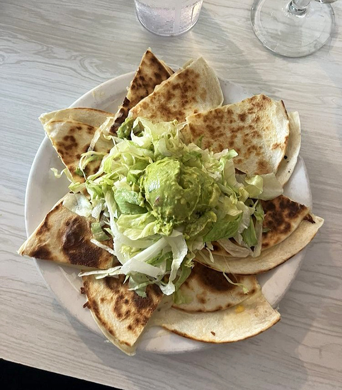 Quesadillas done right&mdash;crispy exterior, molten interior, with jalape&ntilde;os adding just enough heat to make you reach for that margarita.