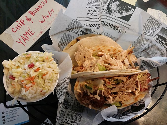 Tacos get the smokehouse treatment, where slow-cooked meat and fresh slaw create perfect handheld happiness with a side of creamy coleslaw.