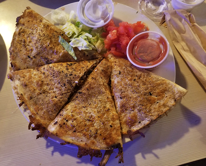 This quesadilla isn't just filled—it's stuffed with smoky treasures, then grilled until the cheese reaches that perfect molten state of bliss.