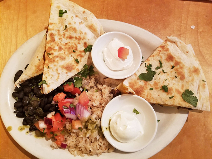 These quesadillas aren't just lunch&mdash;they're diplomatic negotiations between cultures, with cilantro, beans, and rice finding delicious common ground on a perfectly crisped tortilla.