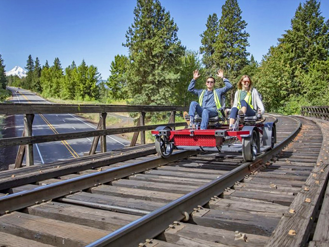 Engineering meets recreation on this trestle crossing. Rail bikers experience the thrill of suspension between earth and sky while Mount Hood stands sentinel in the distance.