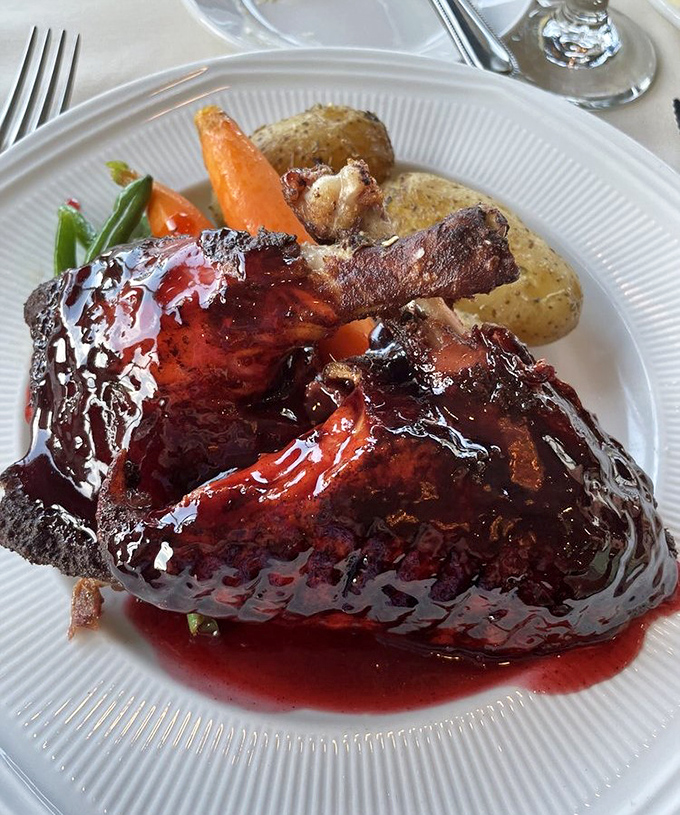 Duck so perfectly lacquered it belongs in a museum, not just on your plate. That glaze is practically hypnotic.