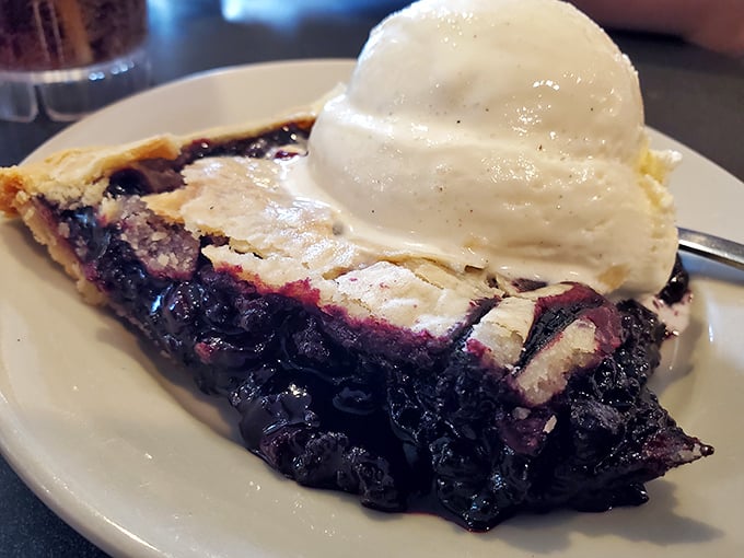 A slice of blueberry pie that demands ice cream companionship. Together they create a hot-cold romance worthy of a dessert romance novel.