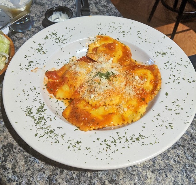 Ravioli that would make an Italian grandmother nod in approval. The sauce-to-cheese ratio achieves that perfect harmony rarely found outside of Naples.