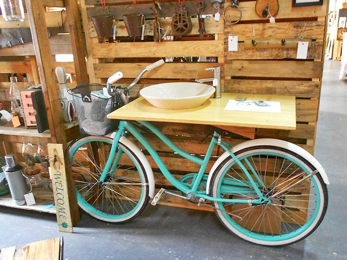 Whoever transformed this turquoise bicycle into a bathroom vanity deserves both an engineering award and a therapy session. Brilliantly bizarre!