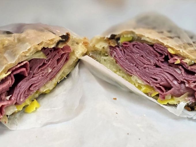 A Reuben sandwich so packed with corned beef it could qualify as a skyscraper in most cities. The structural integrity alone deserves an engineering award.