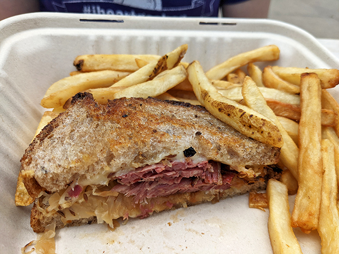 The Reuben sandwich—where corned beef, sauerkraut, and Swiss cheese perform a perfectly choreographed dance between two slices of grilled rye.