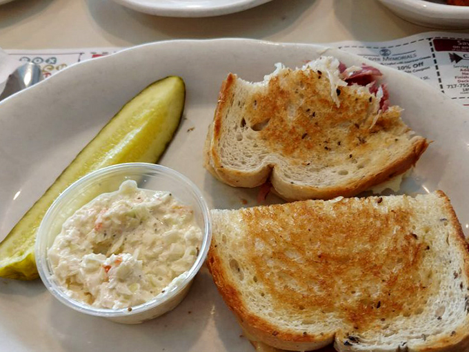 A sandwich and coleslaw duo that proves some of life's greatest pleasures come between two perfectly toasted slices of bread.