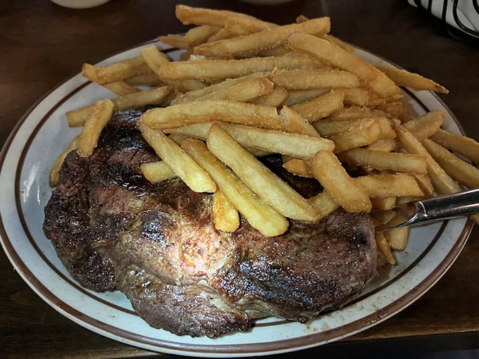 A ribeye that could make a vegetarian question their life choices. That perfect crust is what happens when tradition meets fire.