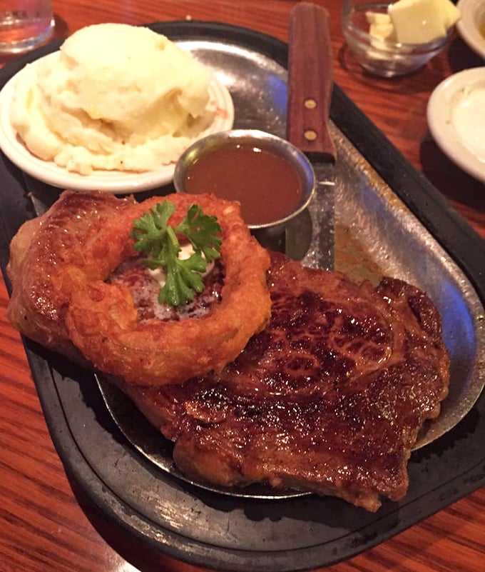 A steak seared to perfection, mashed potatoes with a gravy lake in the middle&mdash;this plate understands the meaning of "comfort food."