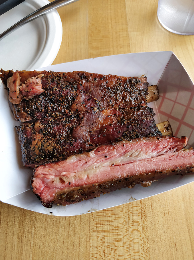 These ribs have that beautiful bark that makes barbecue lovers weak at the knees. The meat's ready to surrender from the bone with just a gentle tug.