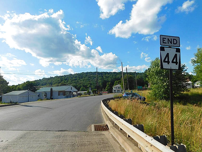 Journey's end marked with a simple sign. After miles of wilderness, civilization returns like an old friend.