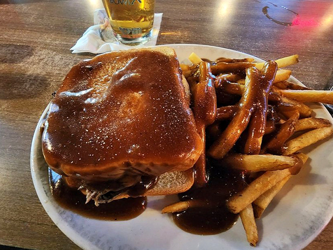 A hot roast beef sandwich swimming in gravy that would make your cardiologist wince and your taste buds applaud. Worth every napkin you'll need.