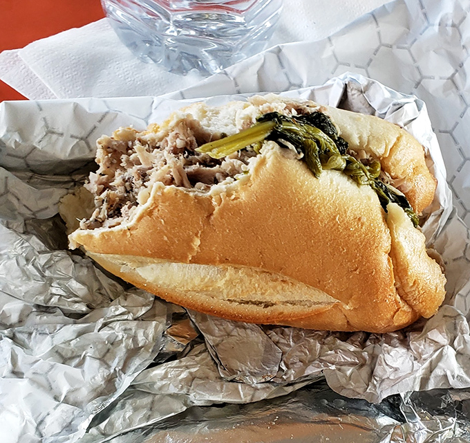 The legendary roast pork sandwich with broccoli rabe—a perfect marriage of tender meat, sharp provolone, and bitter greens that might just change your life.