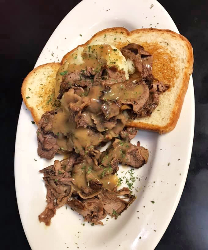 Open-faced roast beef with gravy&mdash;comfort food that whispers, "Don't worry about that afternoon meeting; focus on this moment of meaty bliss."