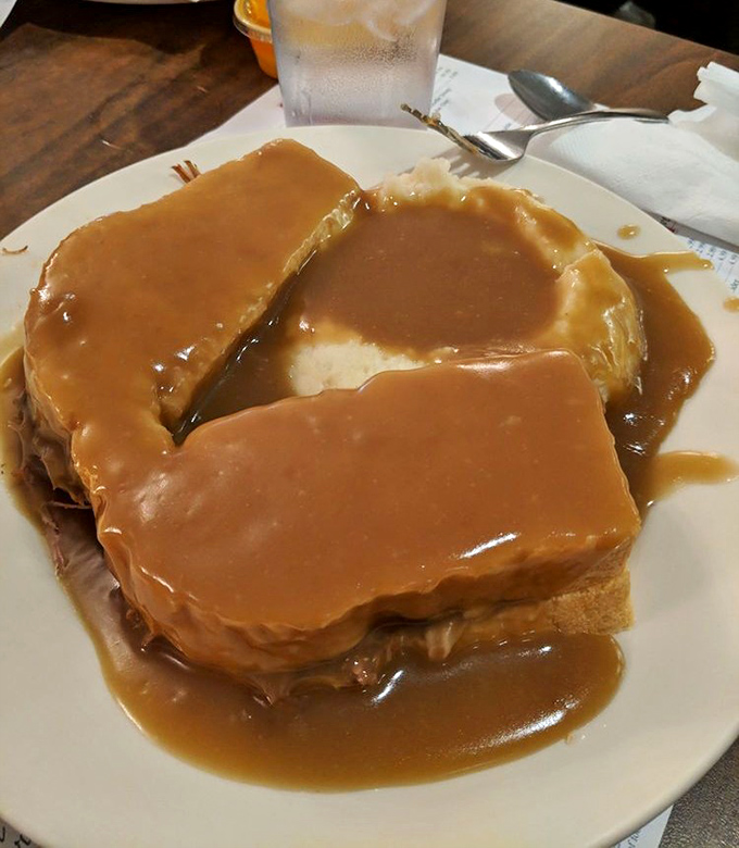 Hot roast beef sandwich: where bread becomes merely a delivery system for gravy. Architecture you can eat with a fork.