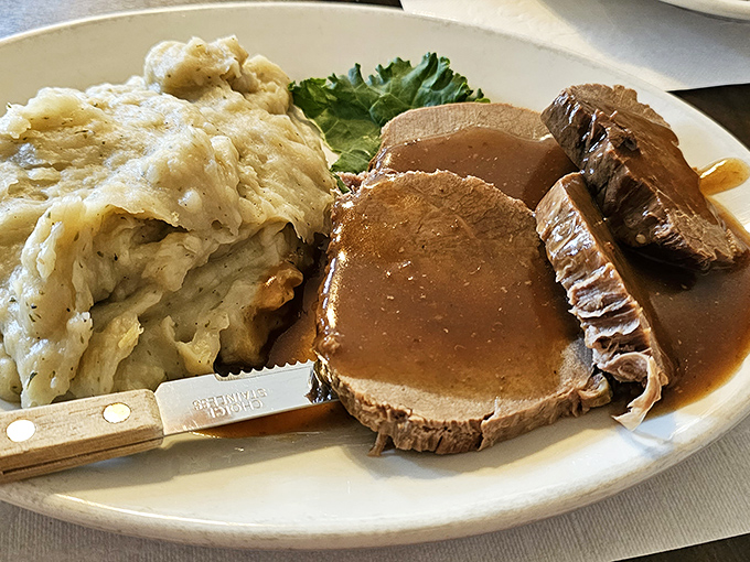 Roast beef so tender you could cut it with a stern look, alongside mashed potatoes that have clearly been on speaking terms with plenty of butter.