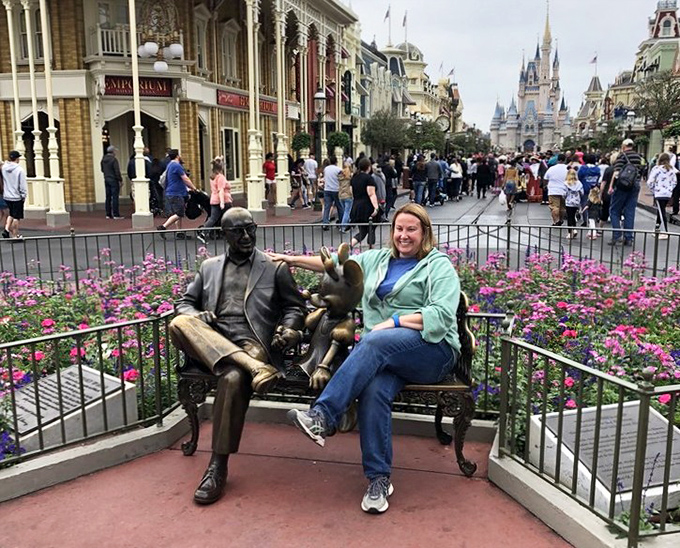 Main Street's statue offers a moment of reflection before the castle vista unfolds, a perfect prelude to the magic ahead.
