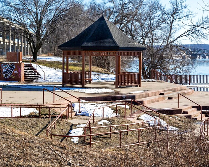 A simple wooden gazebo at Riverfront Park offers front-row seats to nature's greatest show: the mighty Missouri River flowing as it has for millennia.