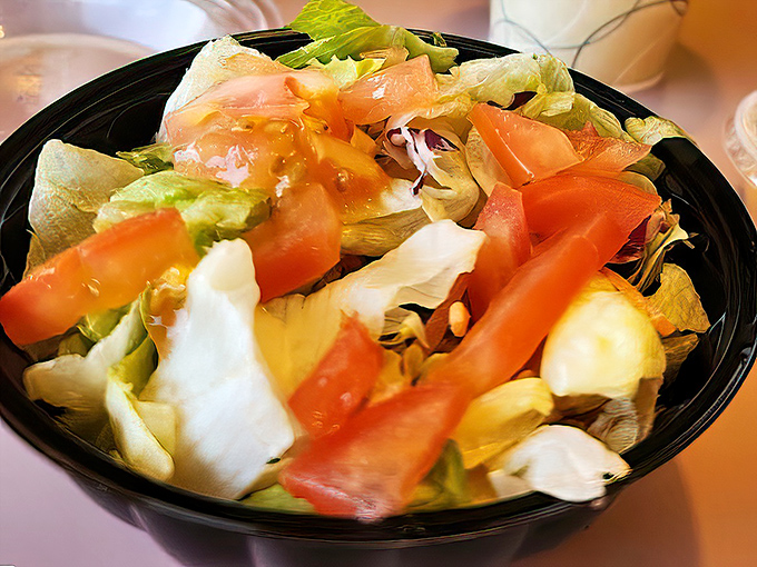 This garden-fresh salad provides the perfect illusion that you're eating healthy before demolishing an entire pizza by yourself.