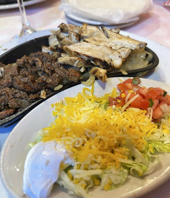 Sizzling fajitas that announce their arrival before you see them, paired with a salad that's actually trying to be more than an afterthought.