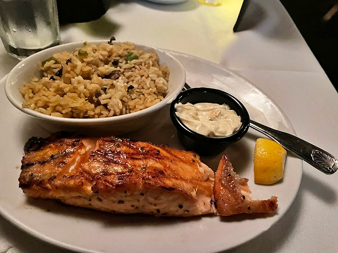Not just salmon, but a testament that The Bull Pen respects seafood as much as steak. Served with rice pilaf and a side of tradition.