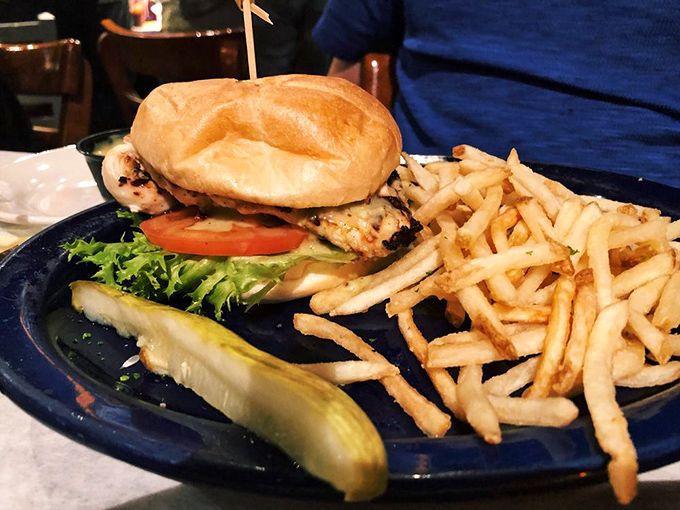 The sandwich that graduated with honors. Fresh greens, juicy chicken, and a bun that somehow manages to hold it all together—like a good education.