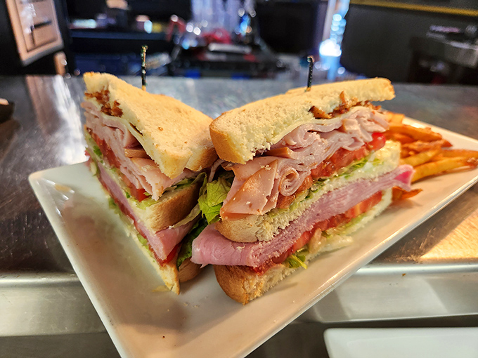 The club sandwich &ndash; mankind's greatest architectural achievement involving bread, meat, and toothpicks &ndash; served with a side of golden fries.