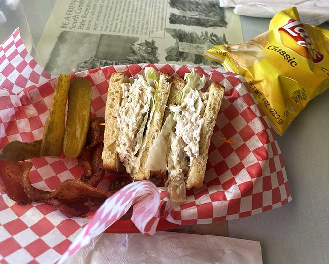 A sandwich served with classic red-checkered flair &ndash; proof that between two slices of great bread, happiness is always possible.