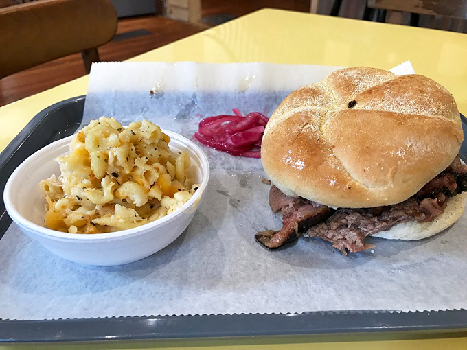 The pulled pork sandwich&mdash;humanity's greatest invention since fire itself. That golden bun is about to embark on the tastiest job of its life. 
