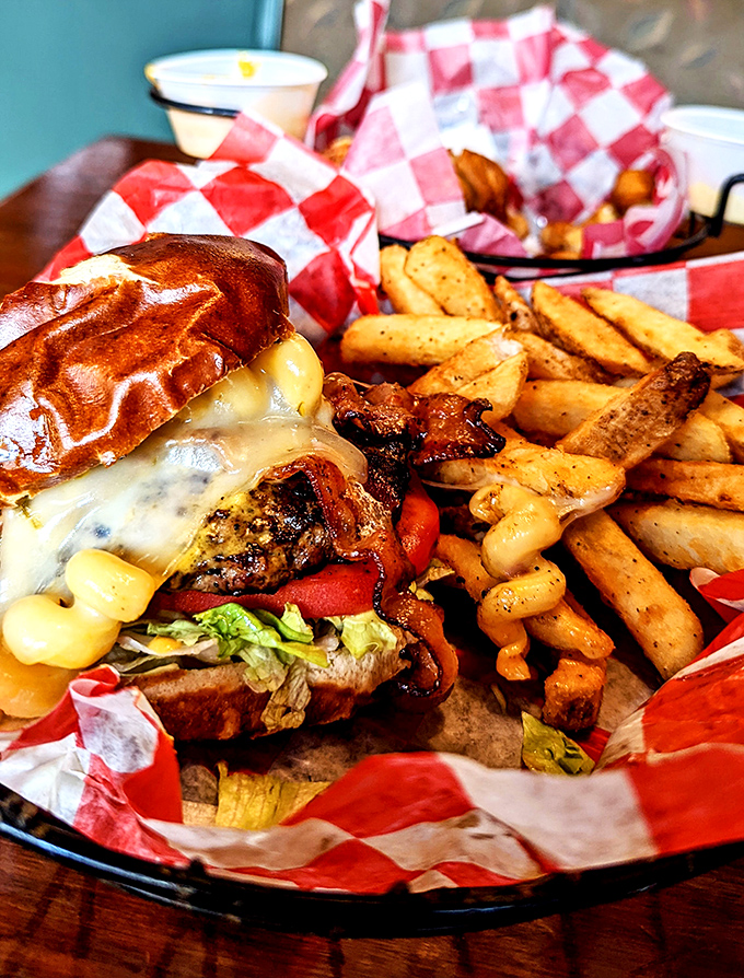 Not just a burger, but a monument to American ingenuity – melted cheese cascading down the sides, served with fries that demand to be noticed.
