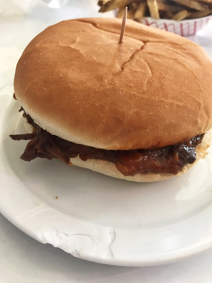 The barbecue sandwich&mdash;tender, saucy perfection on a bun that proves sometimes the simplest pleasures deliver the most profound satisfaction.