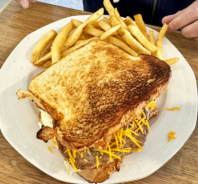 This sandwich isn't just lunch; it's architecture with cheese, a towering achievement of bread engineering.