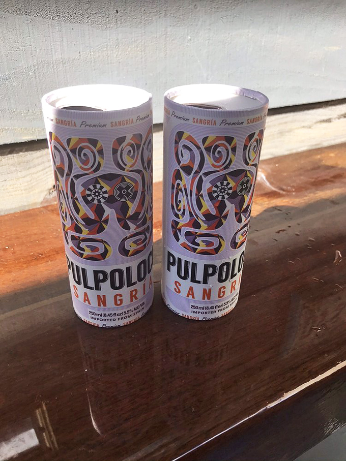 When the Florida heat demands refreshment, these colorful sangrias answer the call—proving that sometimes the best seafood pairing comes in a can.