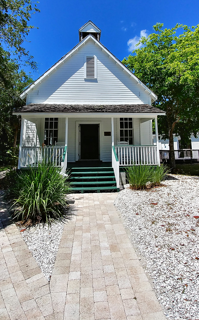 This charming white schoolhouse isn't playing dress-up—it's the real deal, preserved as part of Sanibel's historical village where old Florida lives on.