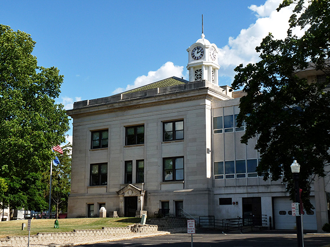 The Sauk County Courthouse stands as a dignified timekeeper of Baraboo life, its clock tower watching over downtown like a benevolent guardian in limestone.