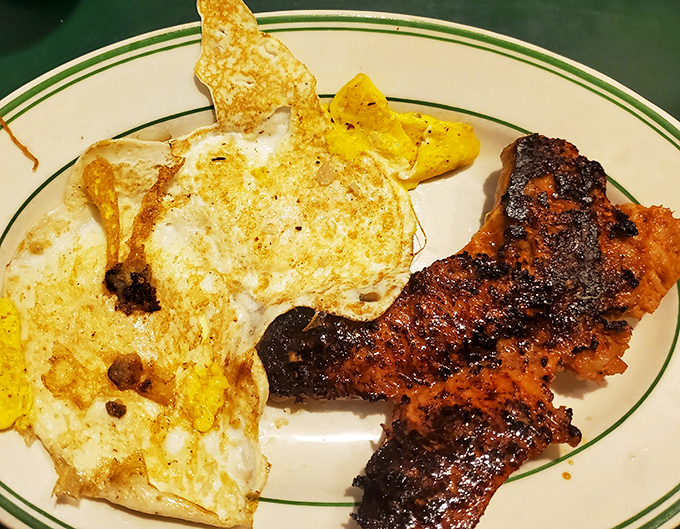 The holy breakfast trinity &ndash; perfectly cooked eggs, bacon with that ideal crisp-to-chew ratio, and home fries that deserve their own fan club.