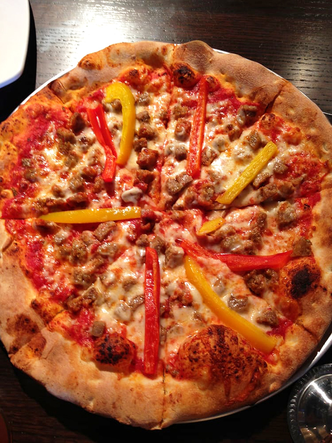 Sausage and peppers pizza that would make Tony Soprano weep with joy&mdash;simple ingredients elevated to art form.