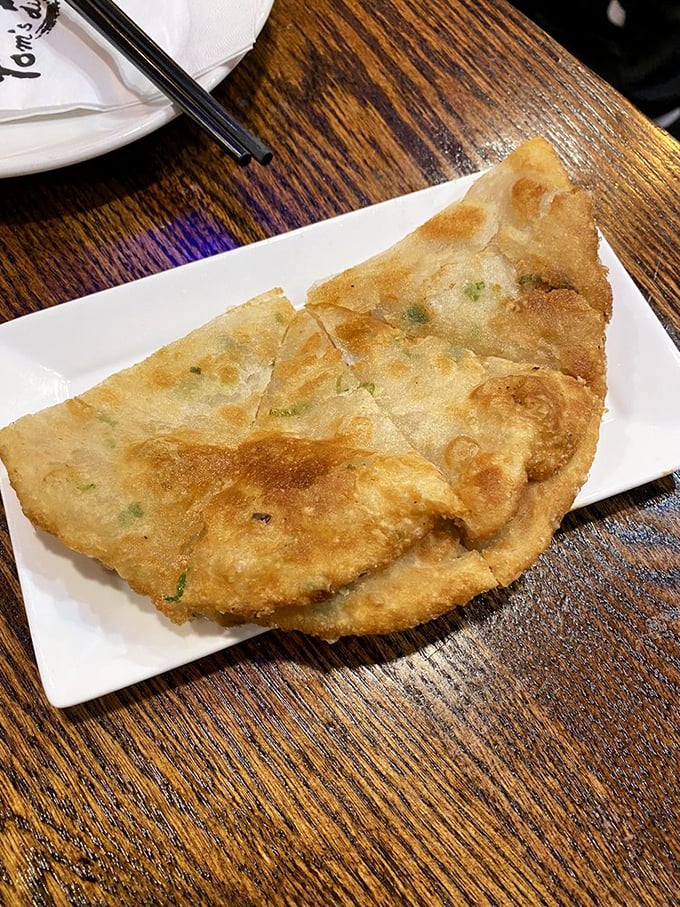 The scallion pancake: crispy, flaky, and ready for its close-up. It's the supporting actor that steals the whole show.