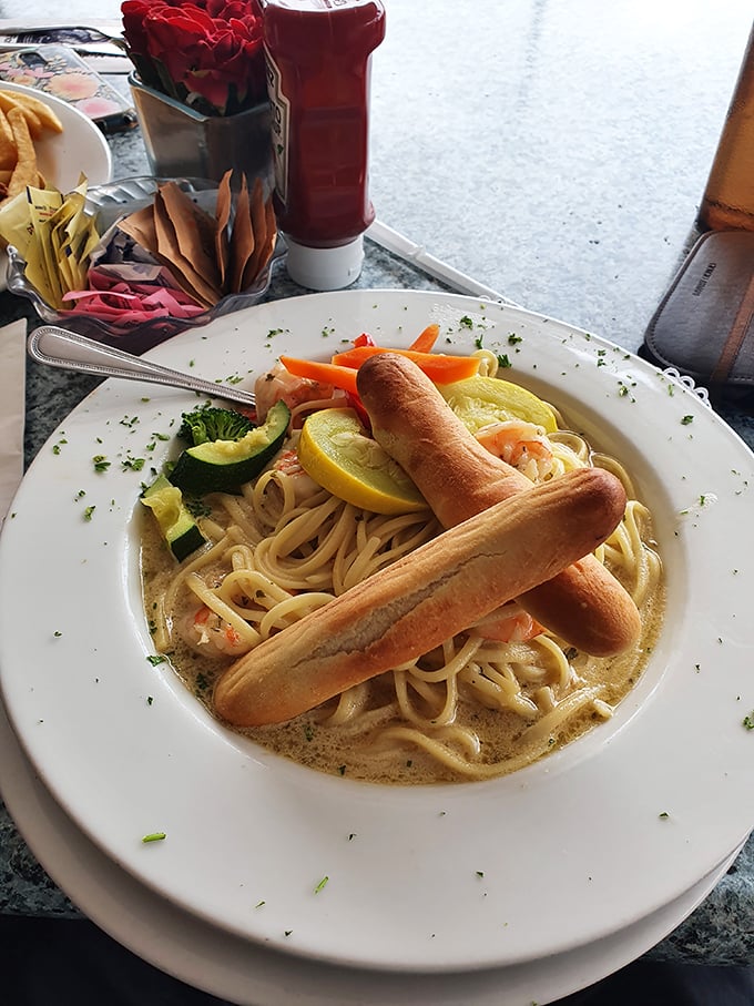 Pasta that would make an Italian grandmother nod in approval. Those breadsticks aren't just for dipping—they're for conducting the orchestra of flavors.
