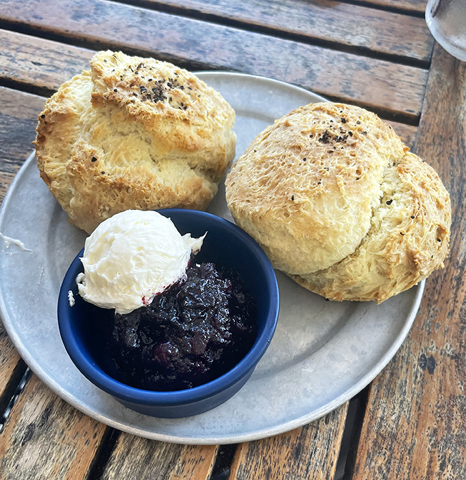 These aren't just biscuits – they're cloud-like vessels for blueberry jam and whipped butter that would make your cardiologist weep.